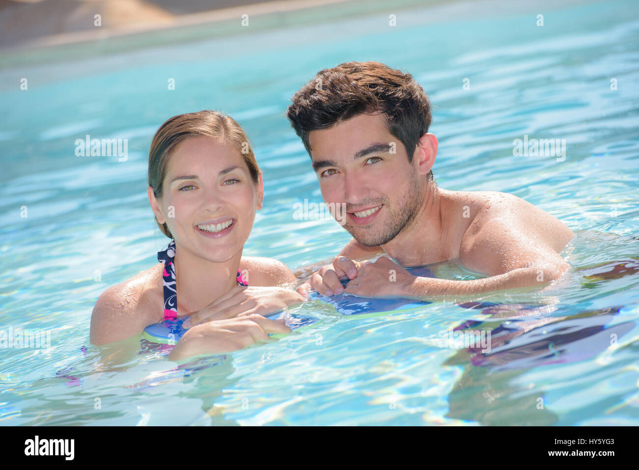 couple in swimming pool Stock Photo - Alamy