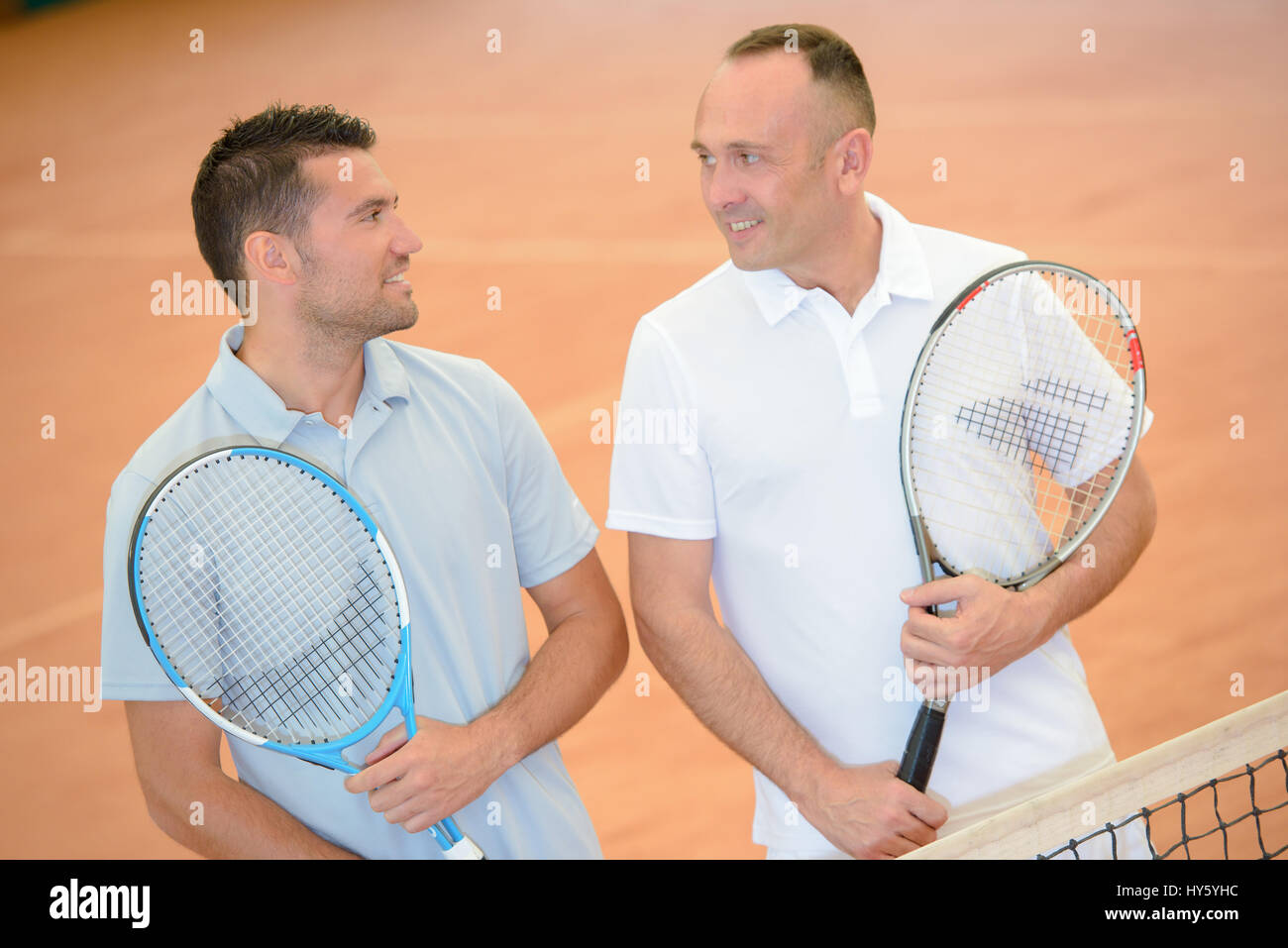 tennis players having a talk Stock Photo - Alamy