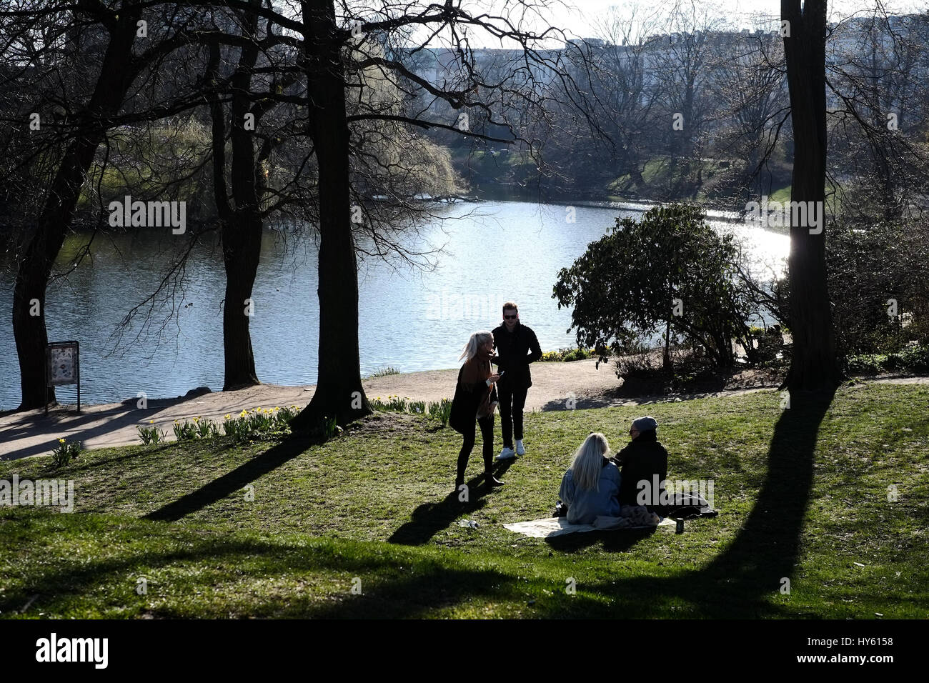 Visitors enjoying a strong spring sun at Ørstedsparken, a city centre ...