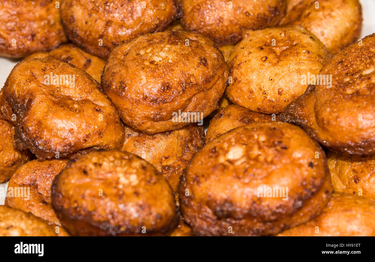 Donuts frying in deep fat. Preparation of traditional donuts Homemade ...
