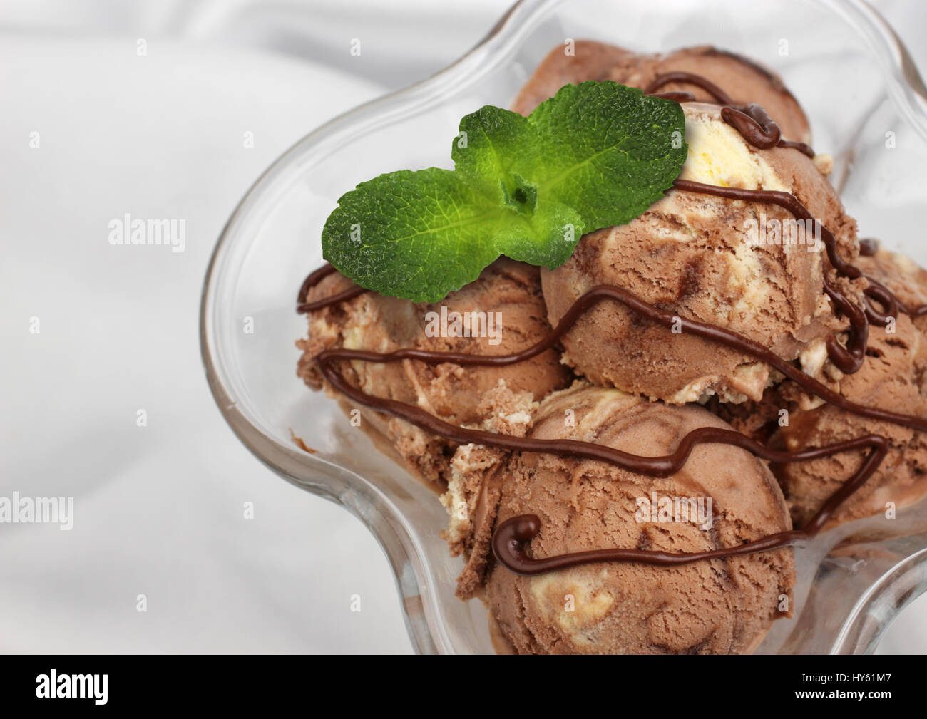 close-up brown ice cream curls with chocolate sauce on ramekin Stock ...