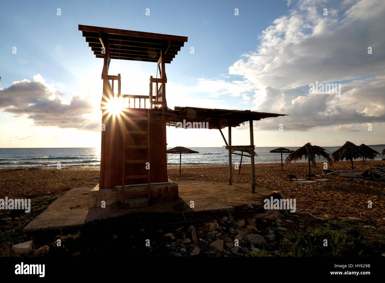 Lifeguard post and beach brollies at Sandy beach in Paphos Cyprus Stock ...