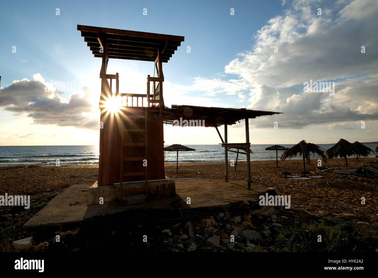 Lifeguard post and beach brollies at Sandy beach in Paphos Cyprus Stock ...