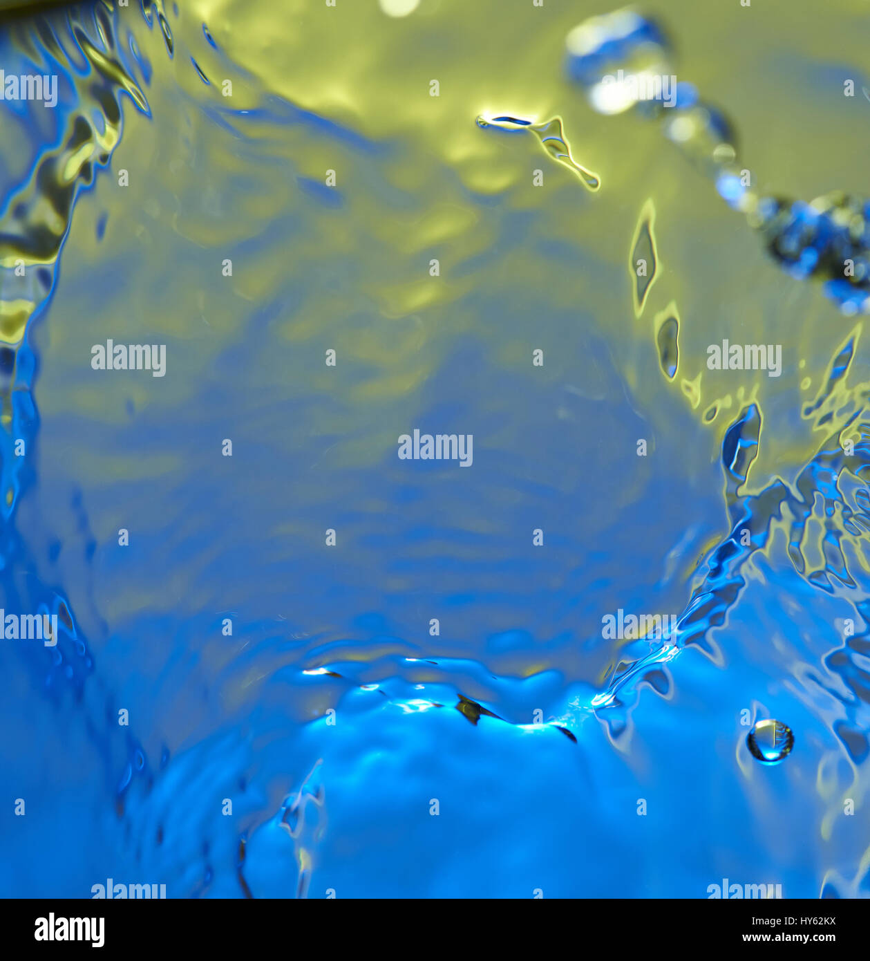 Bright abstract liquid background. Blue and yellow water surface ...