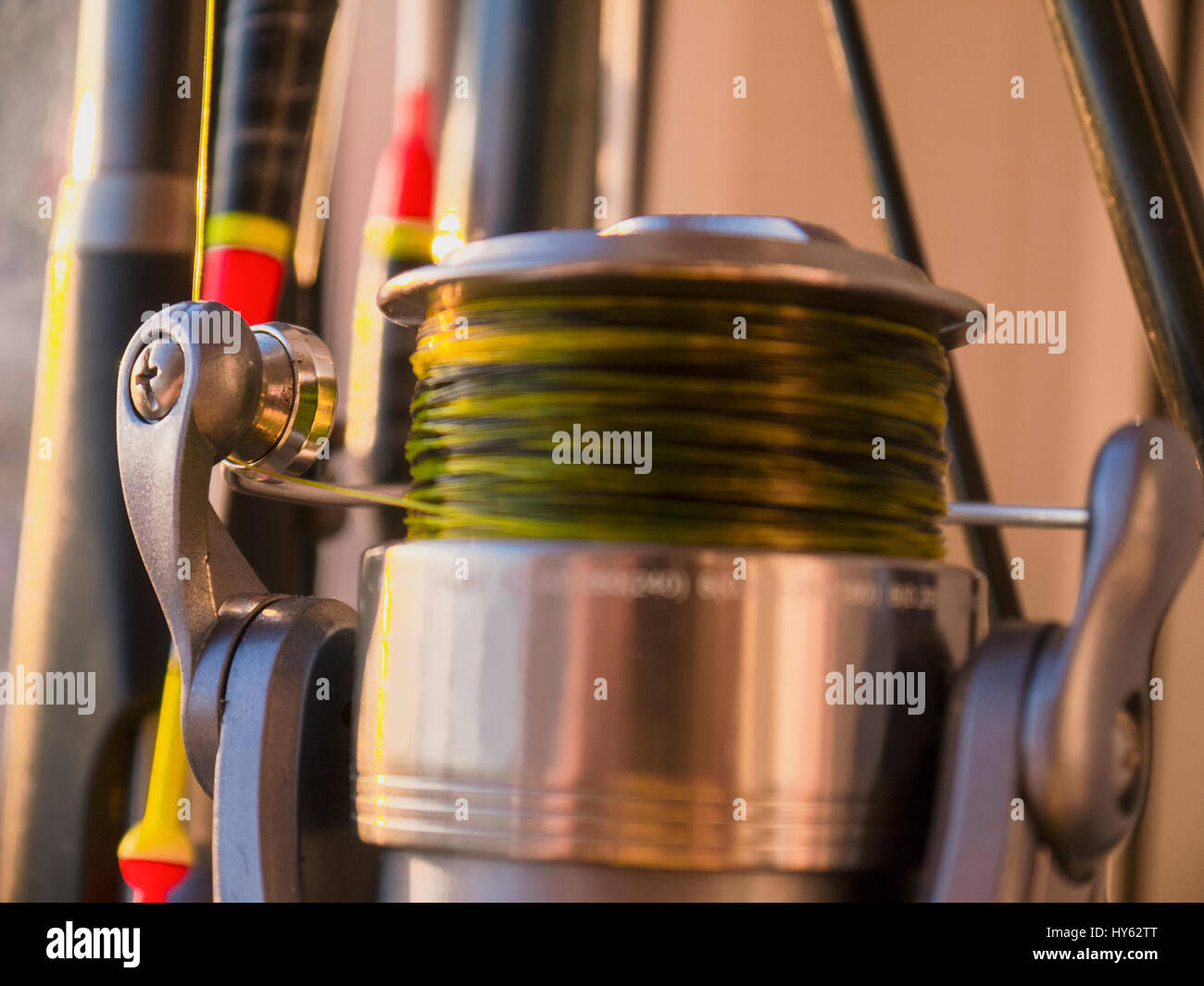The fishing rod, float and fishing reel close-up Stock Photo - Alamy