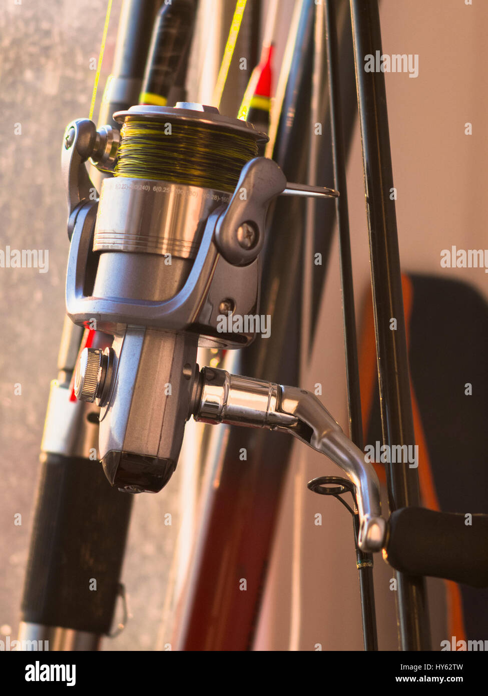 The fishing rod, float and fishing reel Stock Photo - Alamy