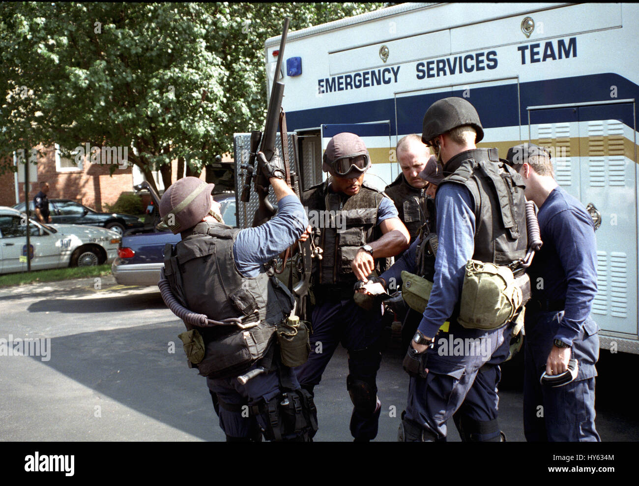 Police SWAT Team prepares for action at a barricade Stock Photo - Alamy