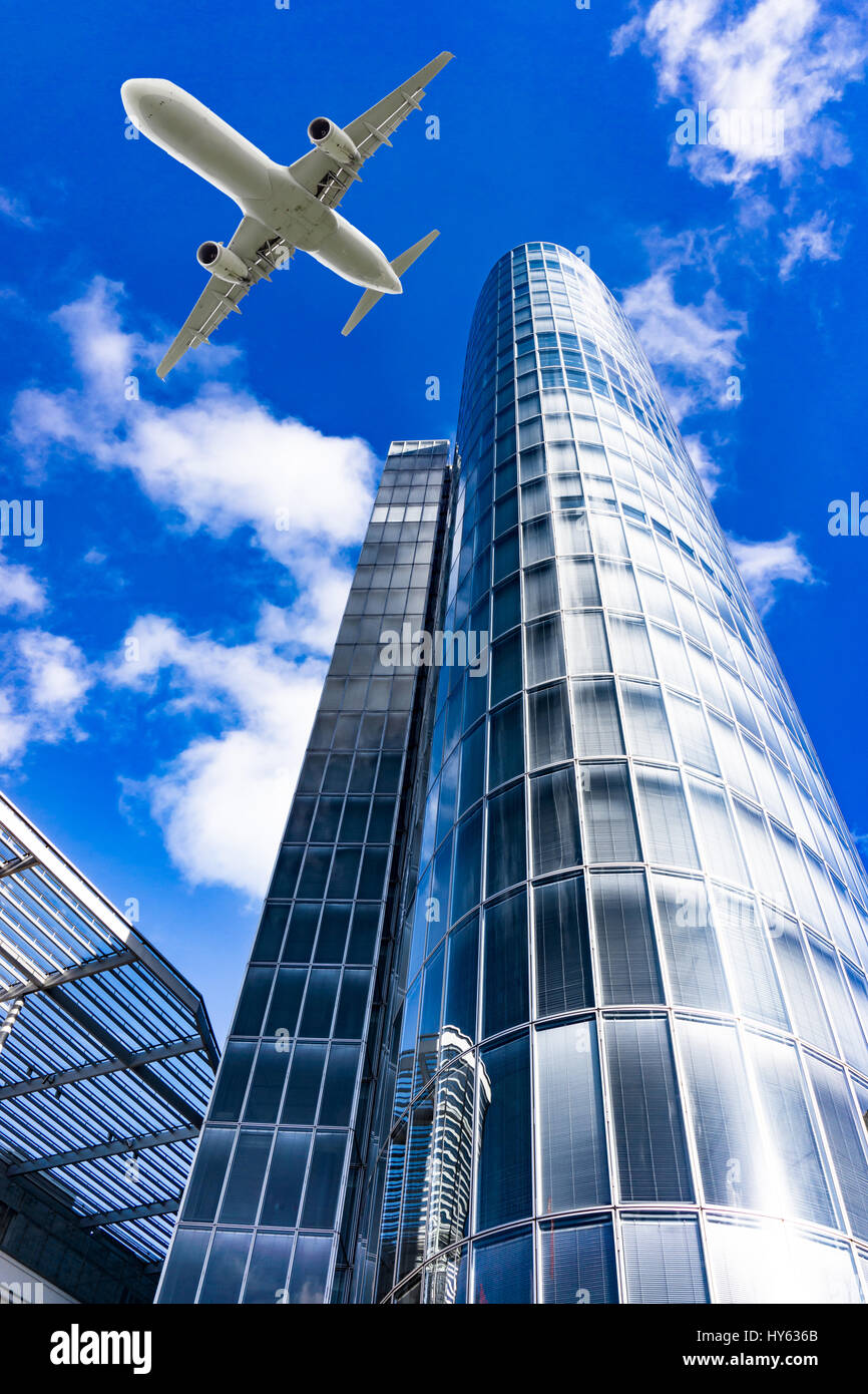 Airplane flying over business skyscrapers hi-res stock photography and ...