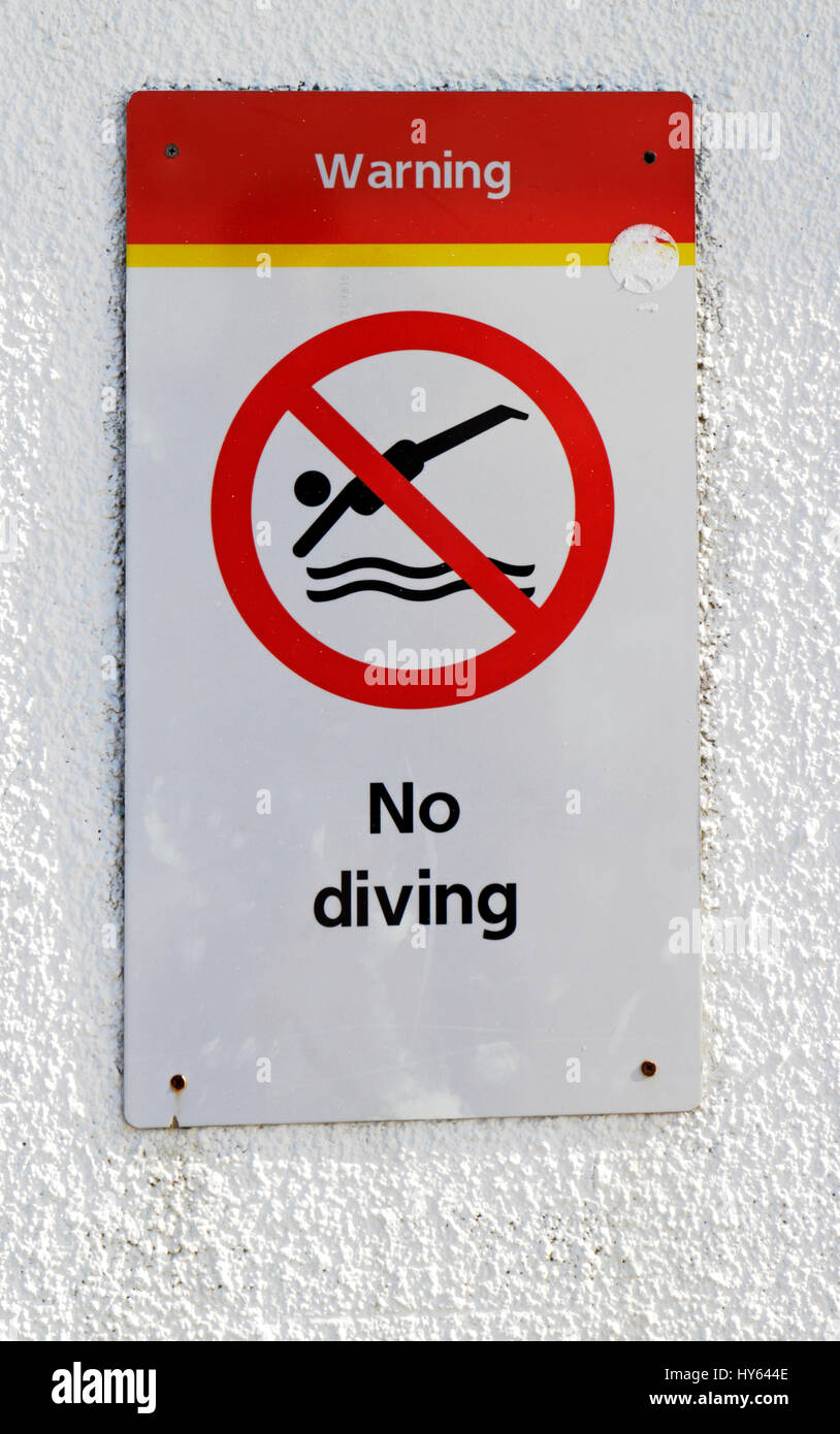 A No Diving sign on the pier in North Norfolk at Cromer, Norfolk ...