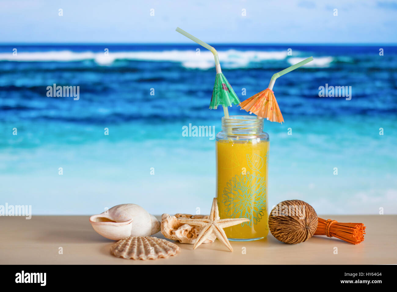 Watermelon smoothie and sea shells on the beach Stock Photo - Alamy
