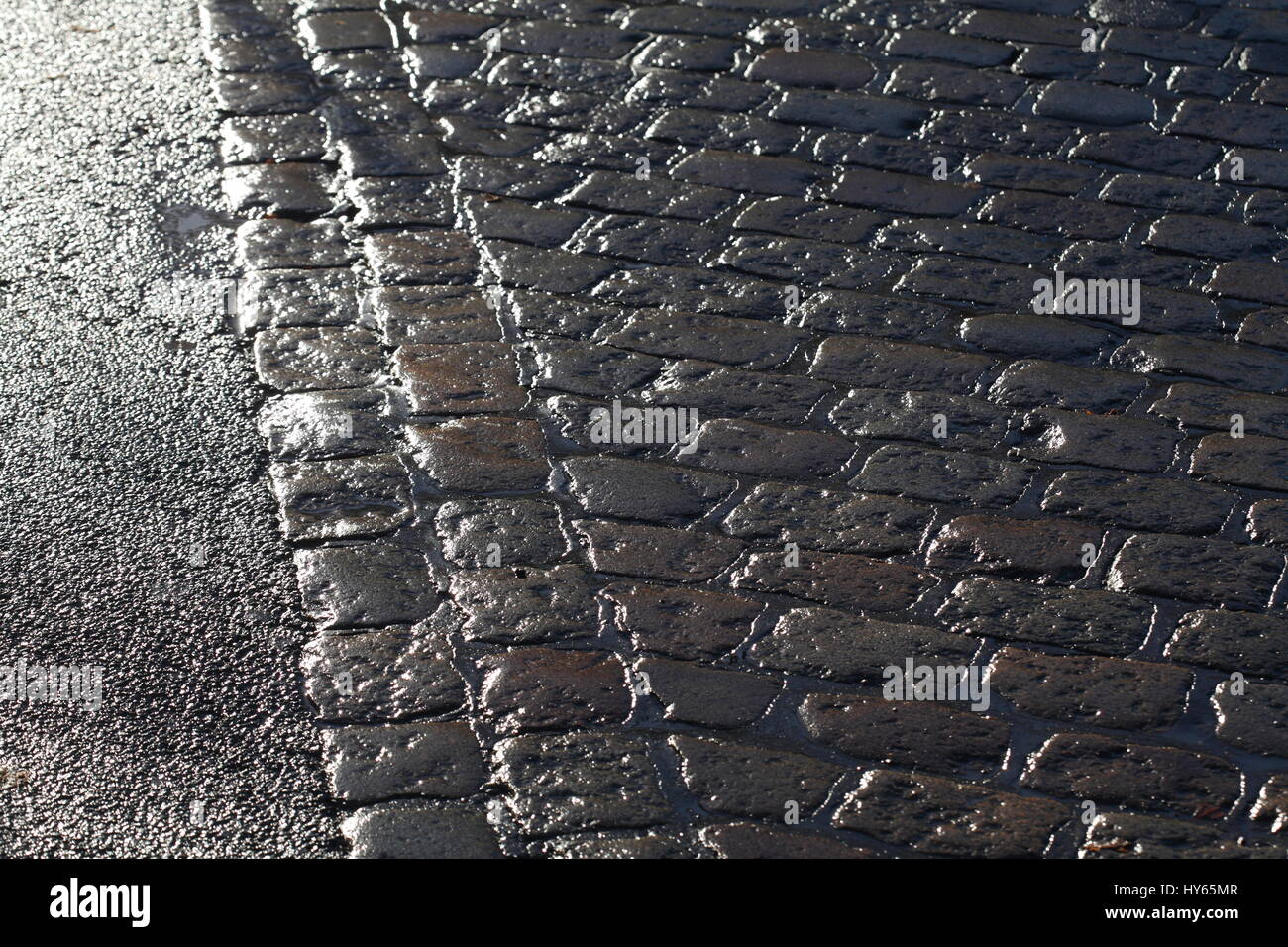 wet glittering paving stones on street Stock Photo - Alamy