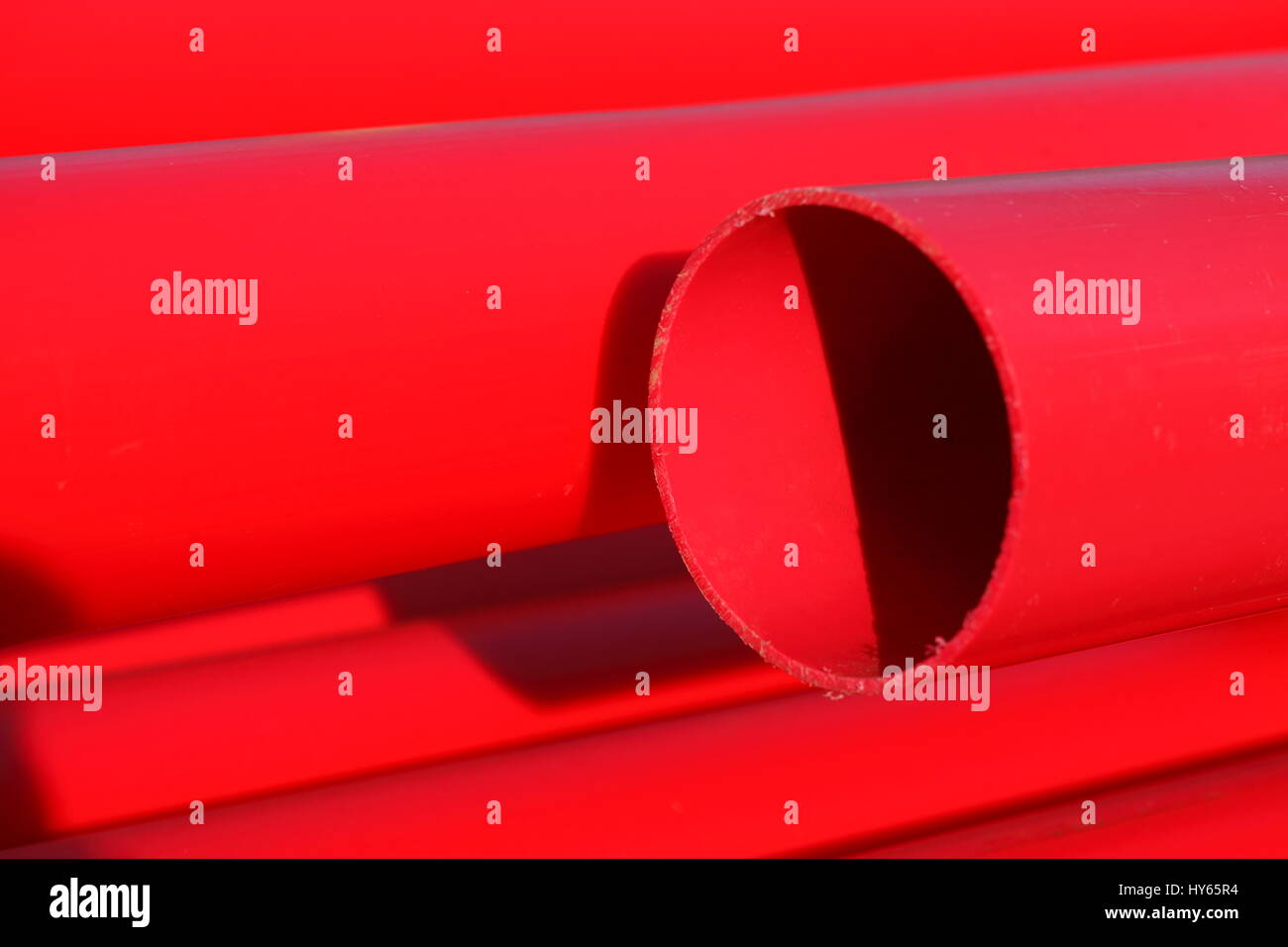 red plastic pipes Stock Photo - Alamy