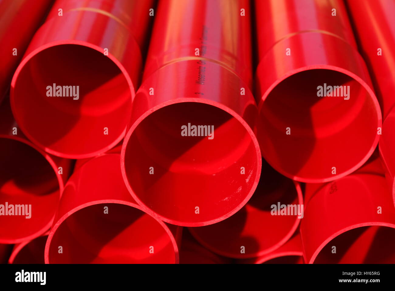 red plastic pipes Stock Photo - Alamy