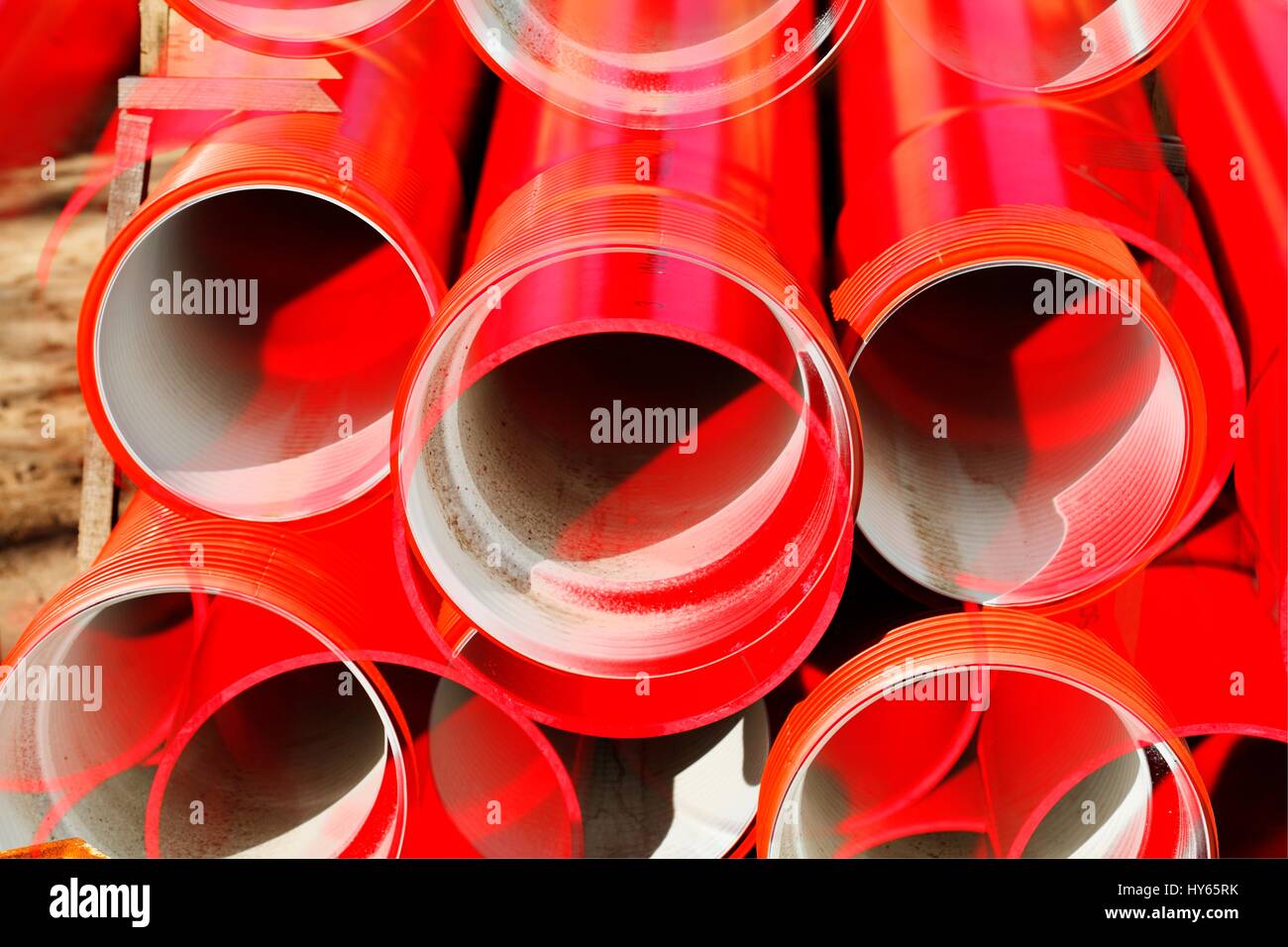 red plastic pipes Stock Photo - Alamy