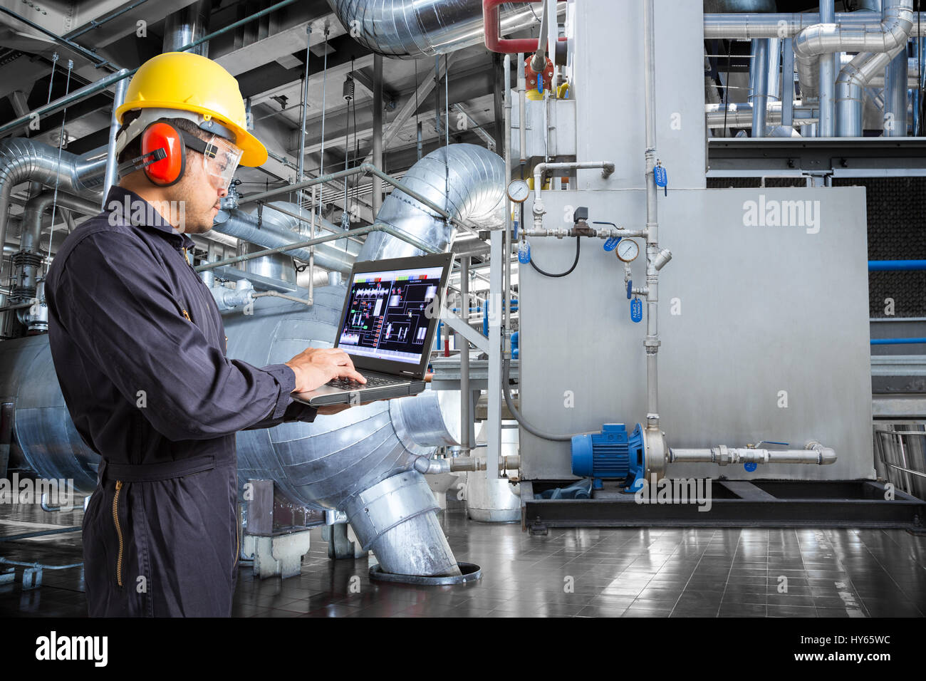 Engineer using laptop computer in thermal power plant factory Stock ...