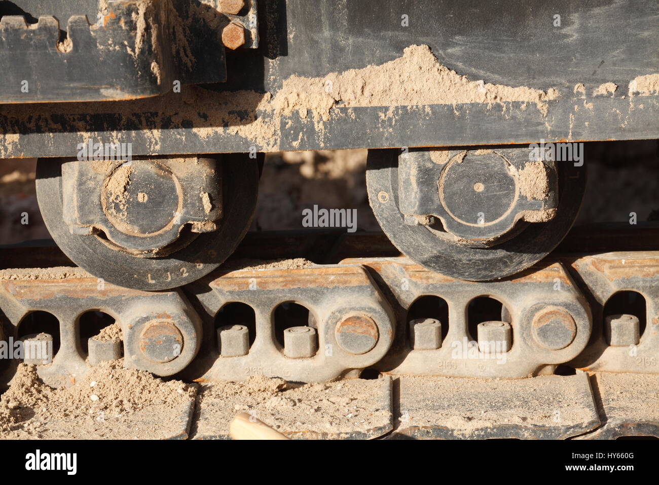 Chain Weels of an Excavator in the Sand Stock Photo - Alamy