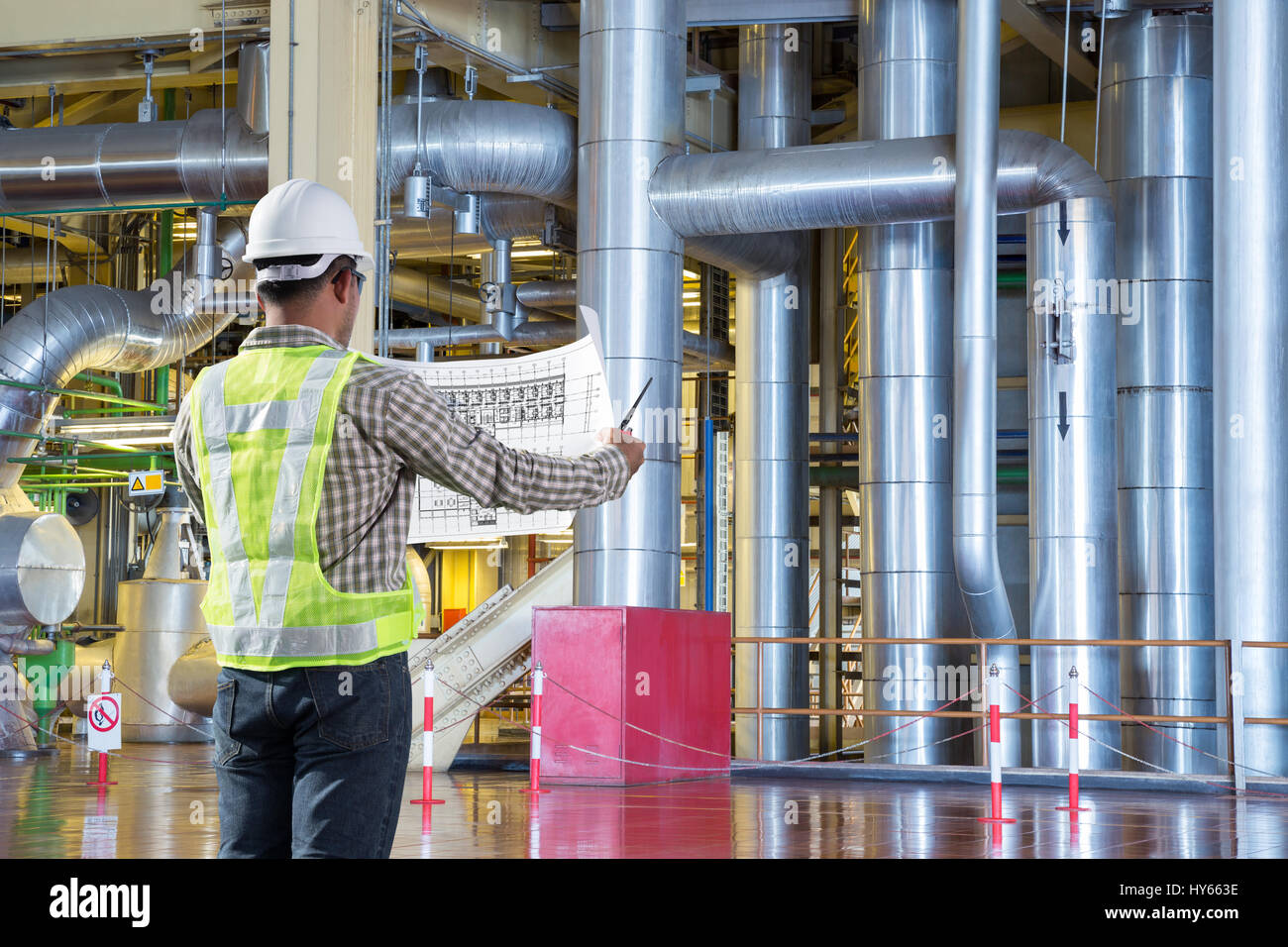 Engineer reading drawing diagram for maintance at thermal power plant ...