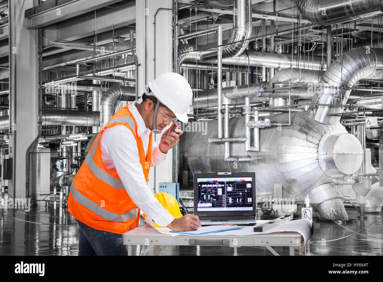 Electrical engineer working at control room of a modern thermal power ...
