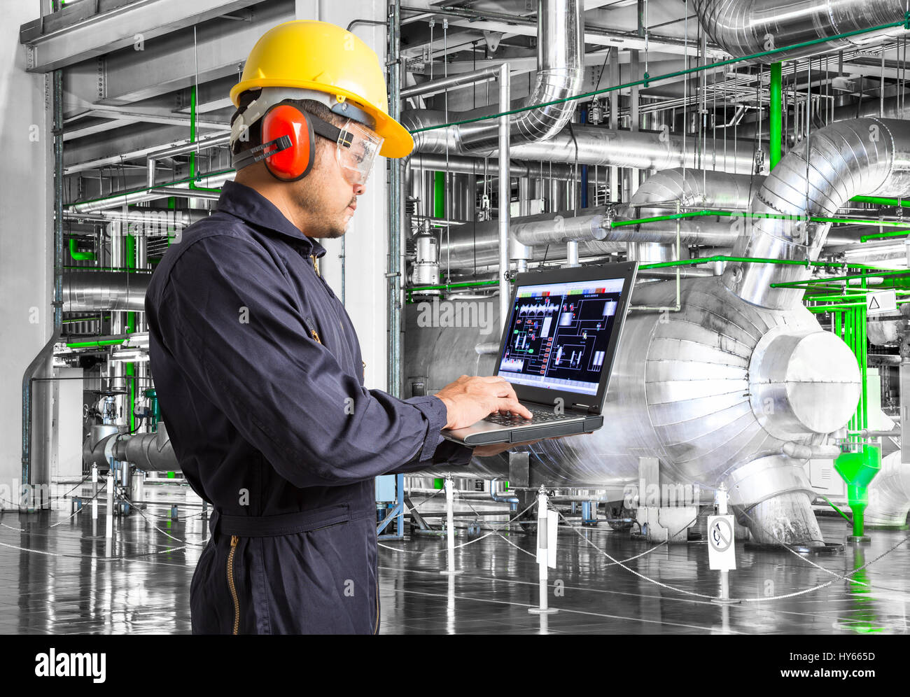 Engineer using laptop computer in thermal power plant factory Stock ...