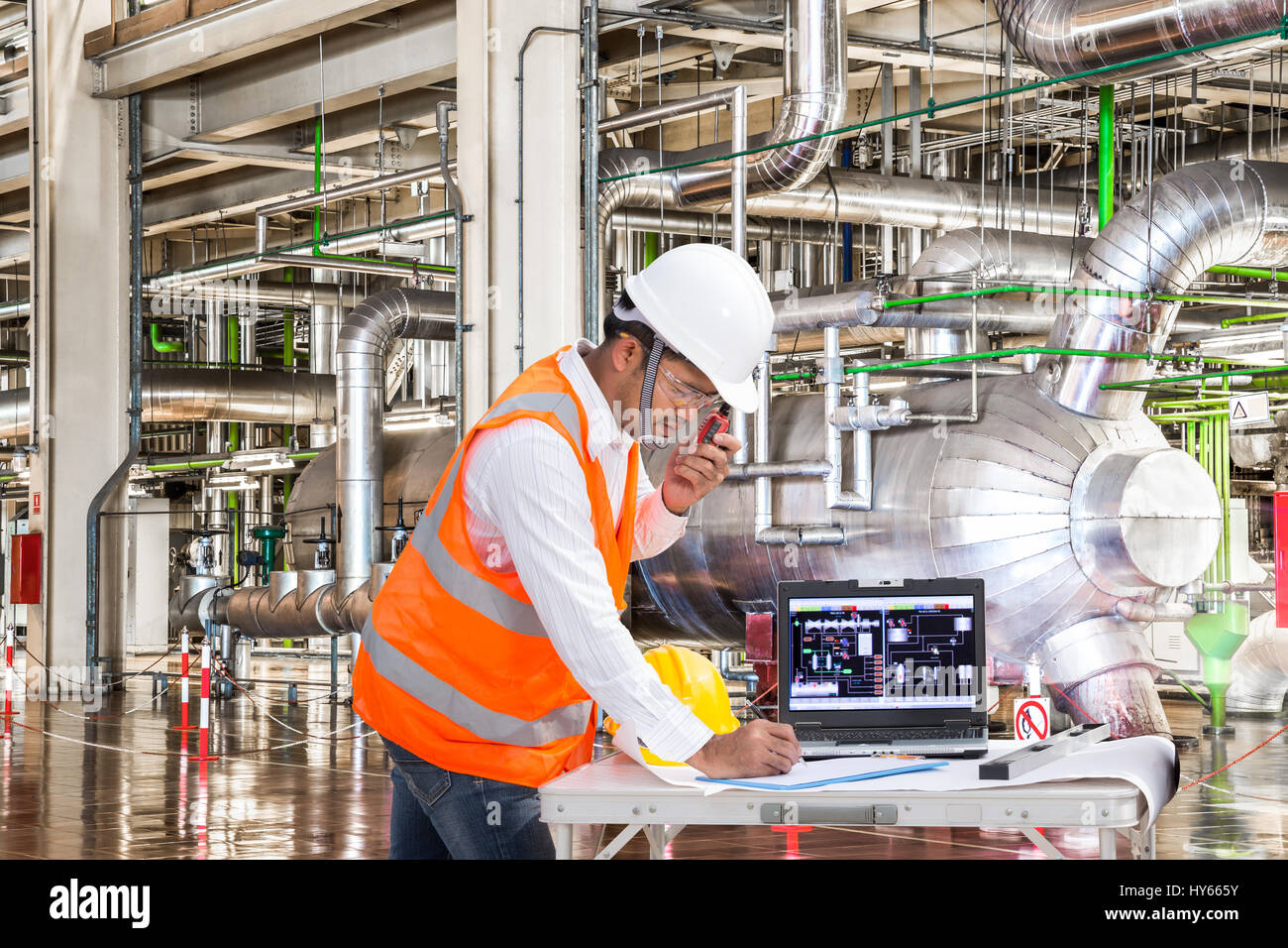 Electrical engineer working at control room of a modern thermal power ...