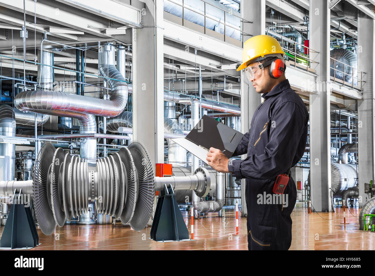 Engineer taking notes at thermal power plant factory Stock Photo - Alamy