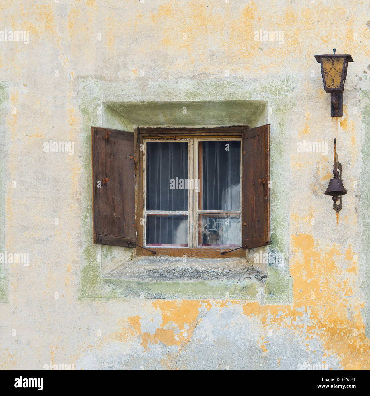 Typical Swiss mountain village window with bell Stock Photo - Alamy
