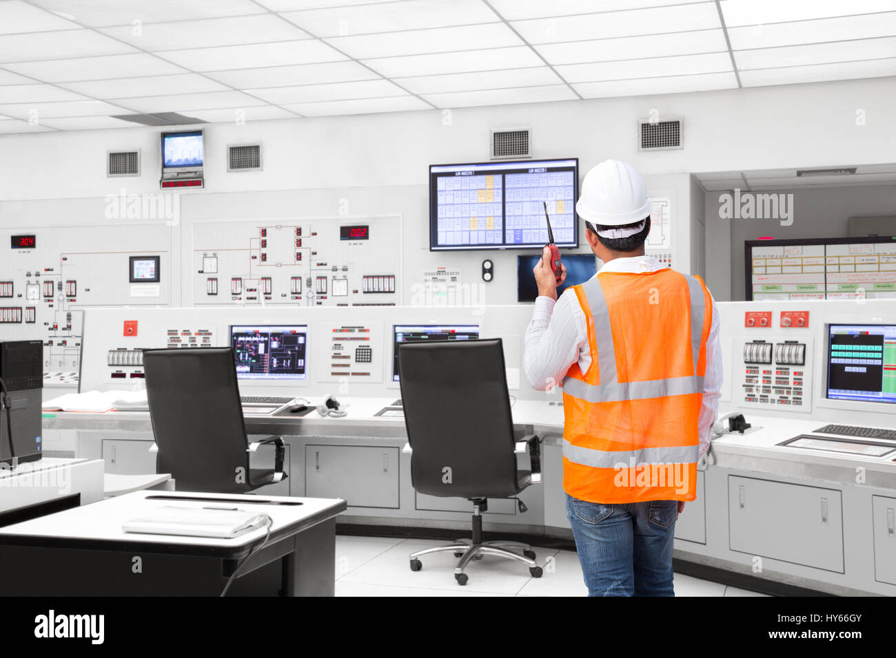 Electrical engineer working at control room of a modern thermal power ...
