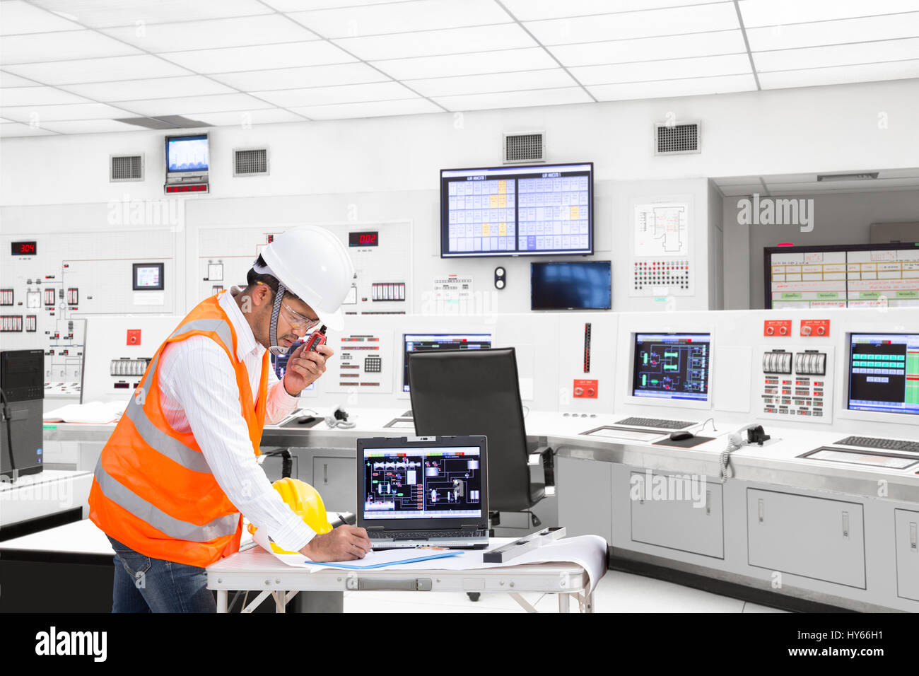 Electrical engineer working at control room of a modern thermal power ...