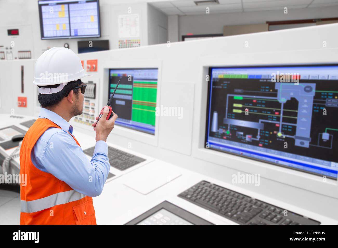 Electrical engineer working at control room of a modern thermal power ...