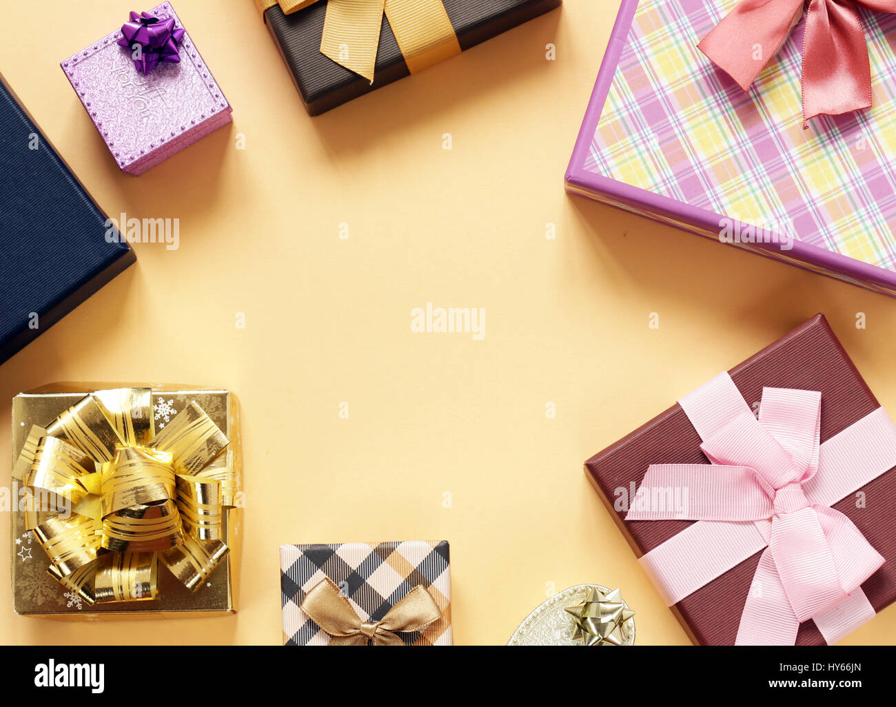 A lot of gift boxes with bows on a beige background Stock Photo - Alamy