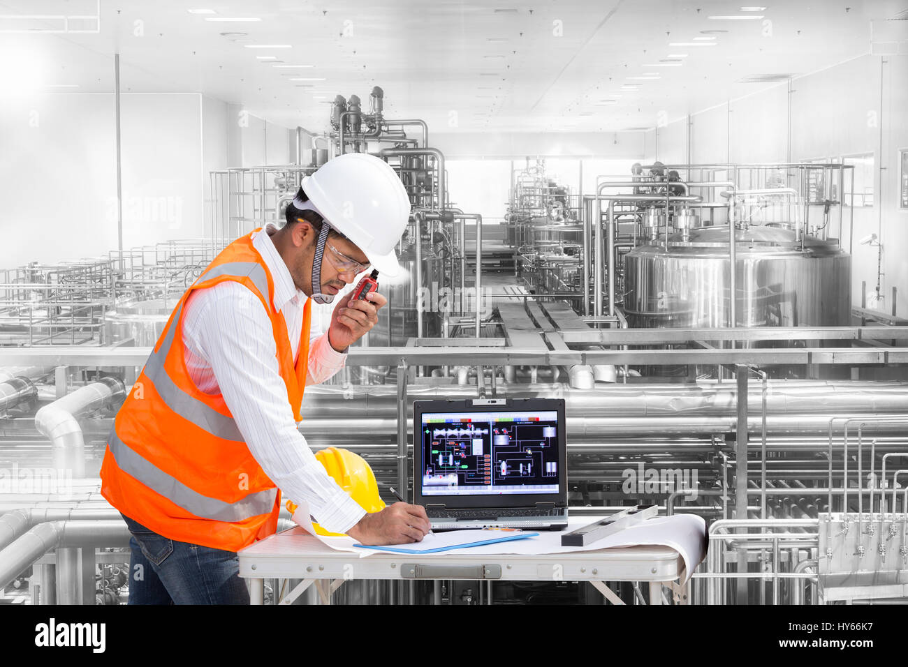 Industrial engineer checking machine status with laptop computer Stock ... Industrial engineer checking machine status with laptop computer Stock ...