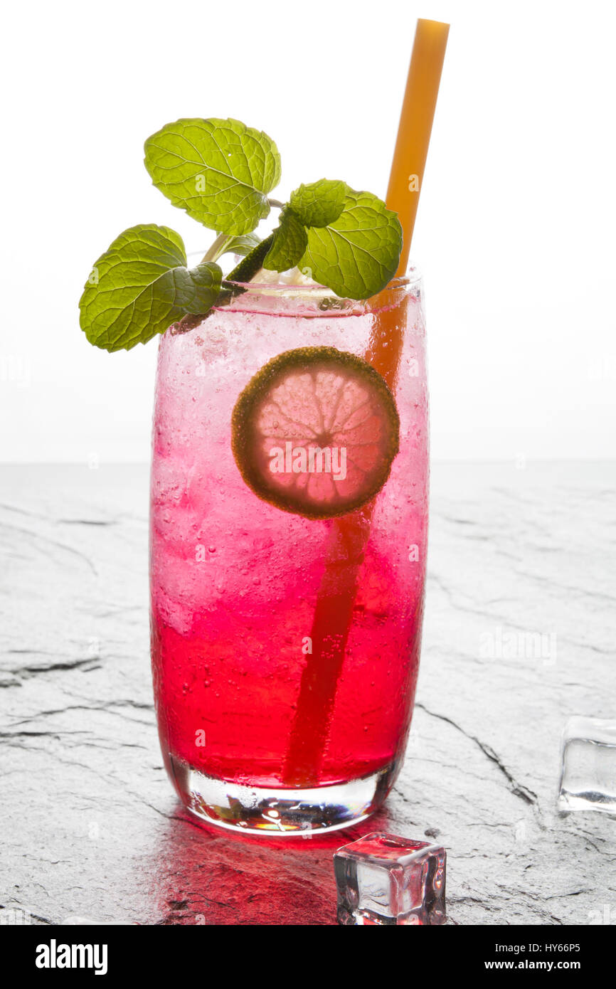 red soda lime drink with lime on stone Stock Photo - Alamy