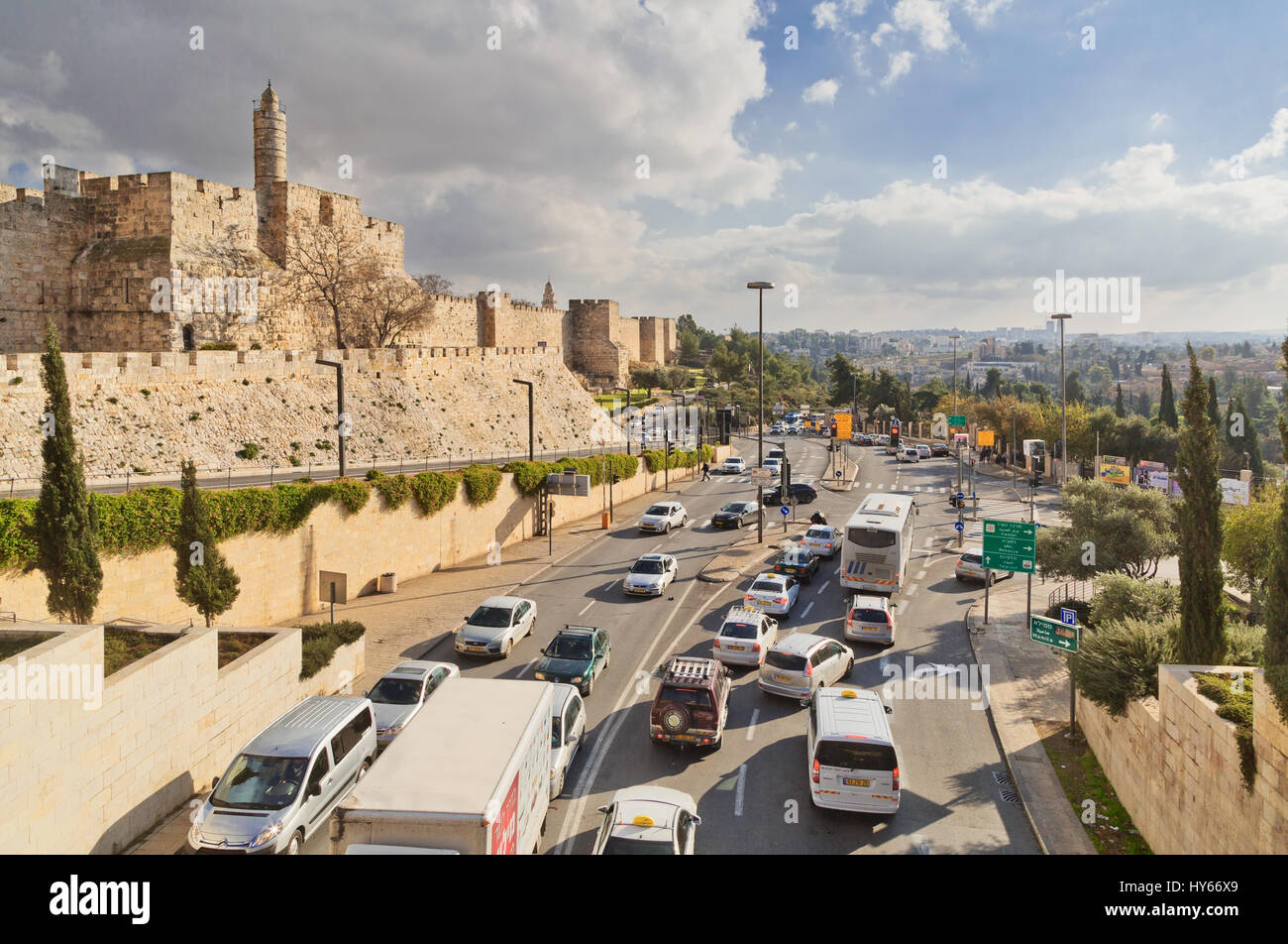 JERUSALEM, ISRAEL - DECEMBER 26, 2016: A road traffic along the wall of ...