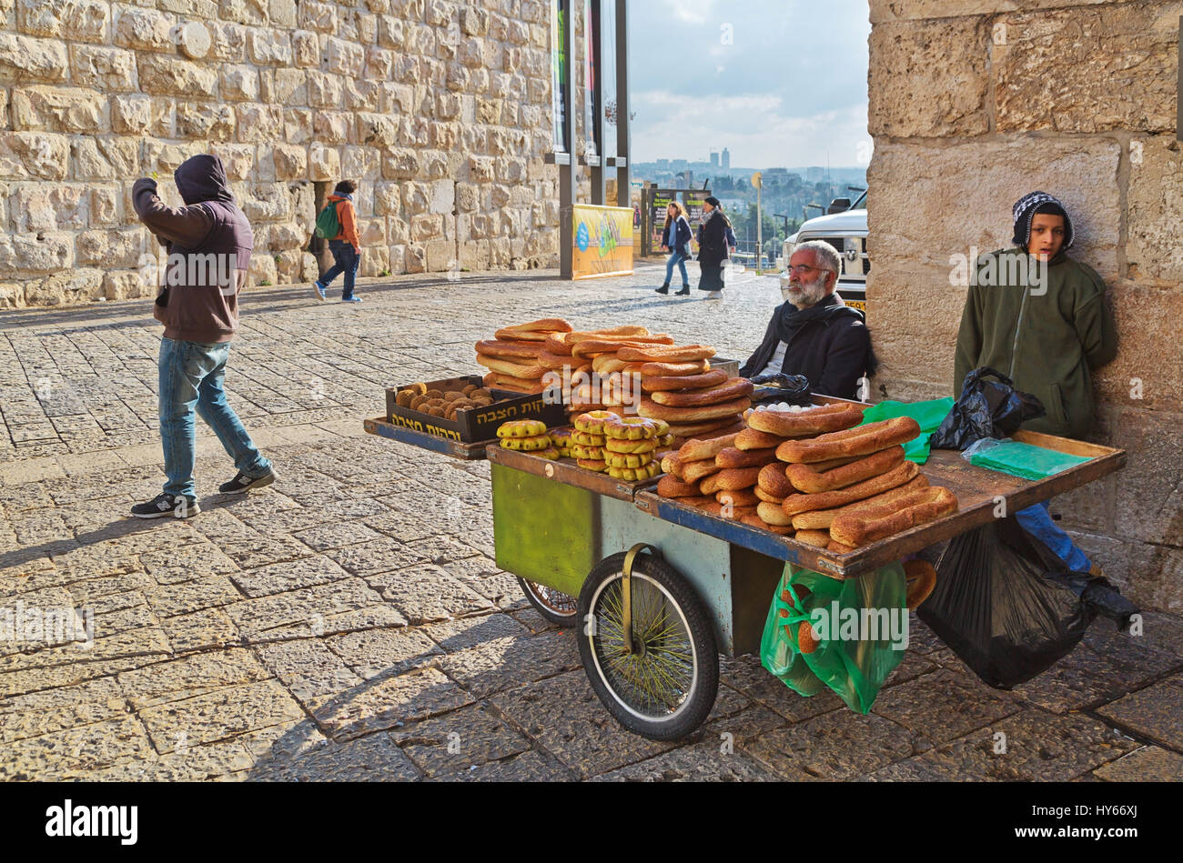 JERUSALEM, ISRAEL - DECEMBER 26, 2016: Street vendor sells bagel bread ...