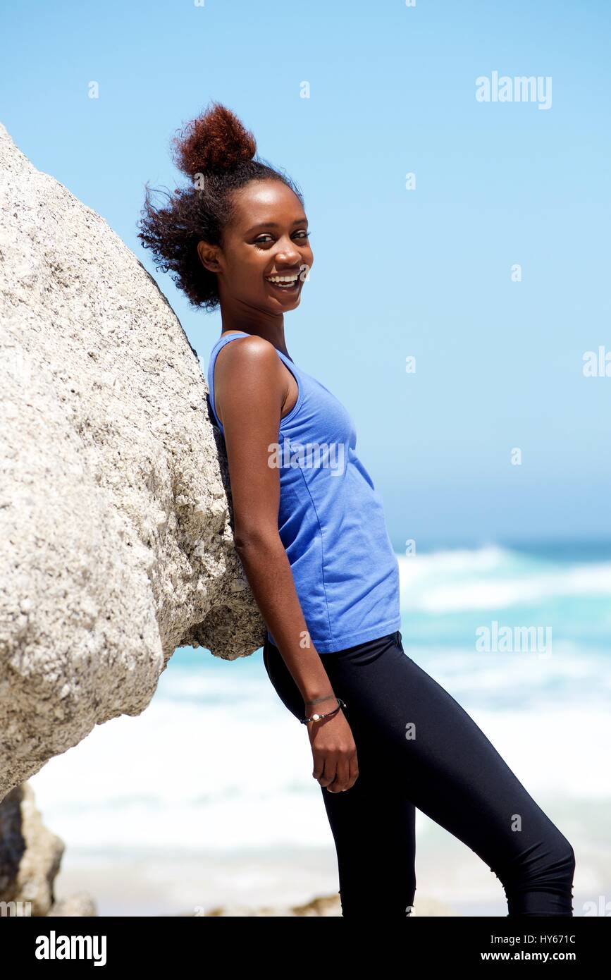 Female leaning against rock hi-res stock photography and images - Alamy