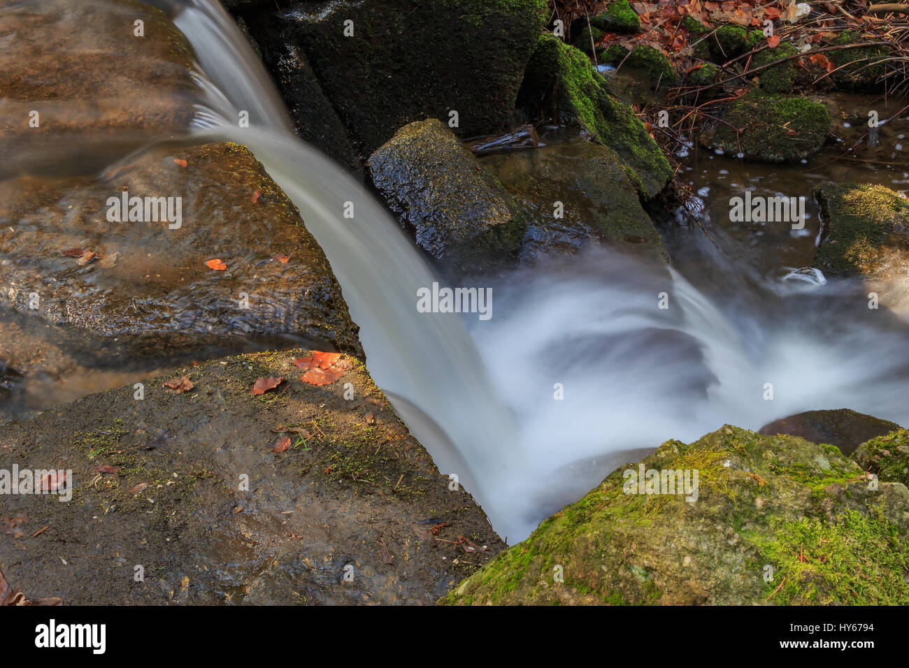 Top view beautiful waterfall flowing streams between stones and rocks ...