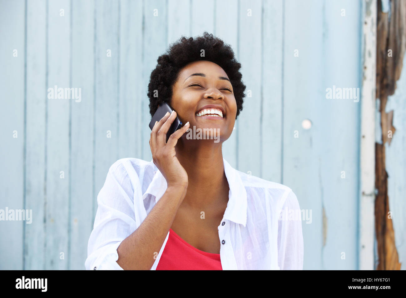 Portrait cheerful african woman talking hi-res stock photography and ...