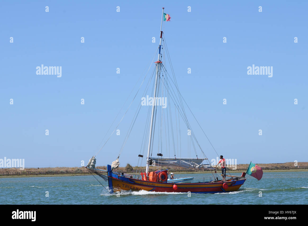 captain on helm on traditional wooden boat Stock Photo - Alamy