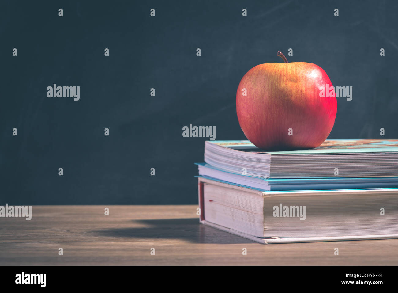 Apple On Stack Of Books - Back To School Stock Photo - Alamy