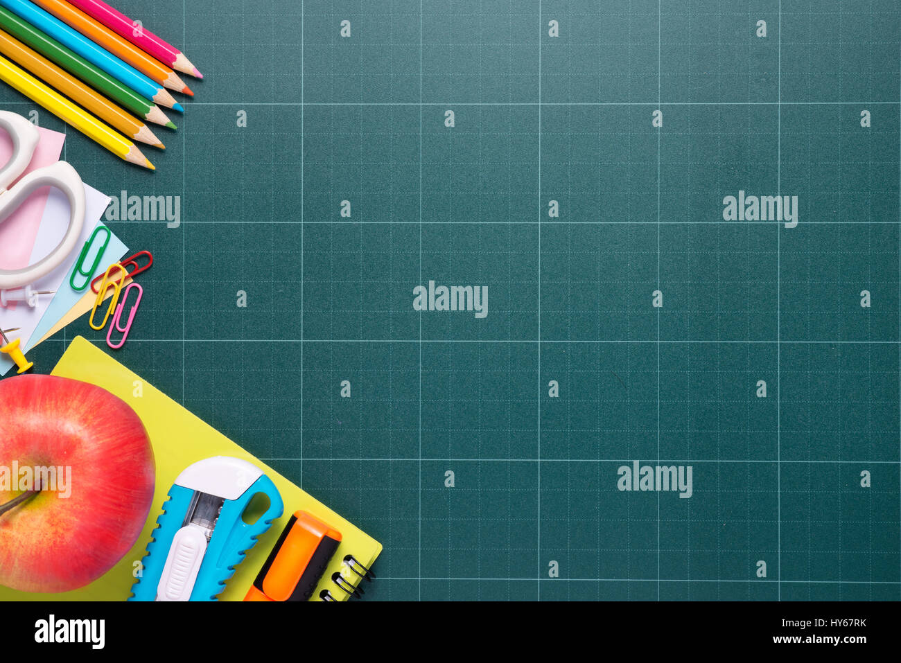 Back to school supplies. Books and chalkboard Stock Photo - Alamy
