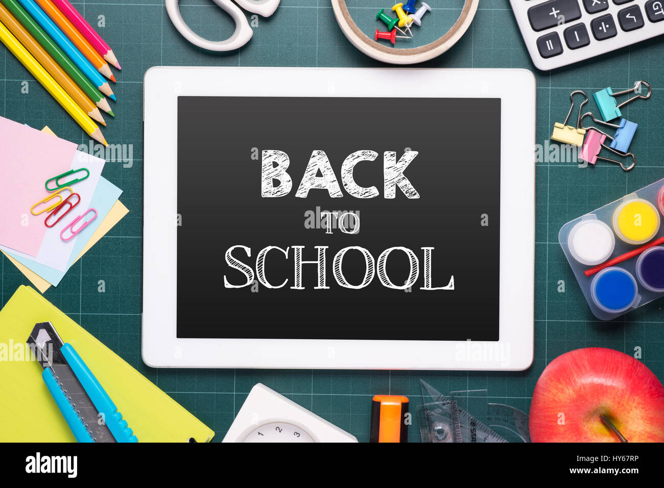 Back to school supplies. Books and chalkboard Stock Photo - Alamy