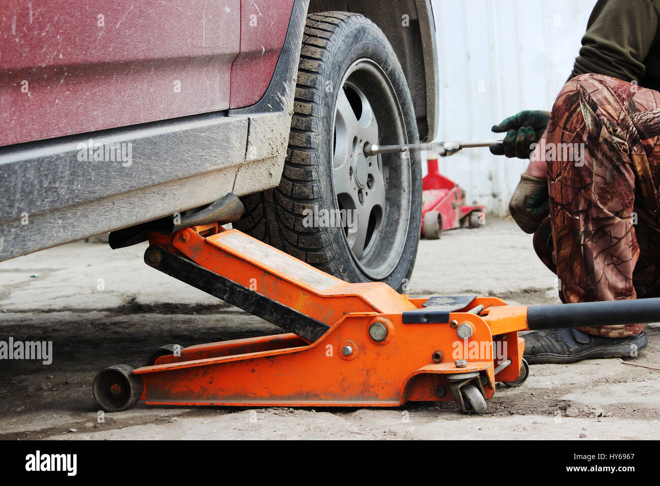 installation of passenger car wheel and replacement on spring tire in ...