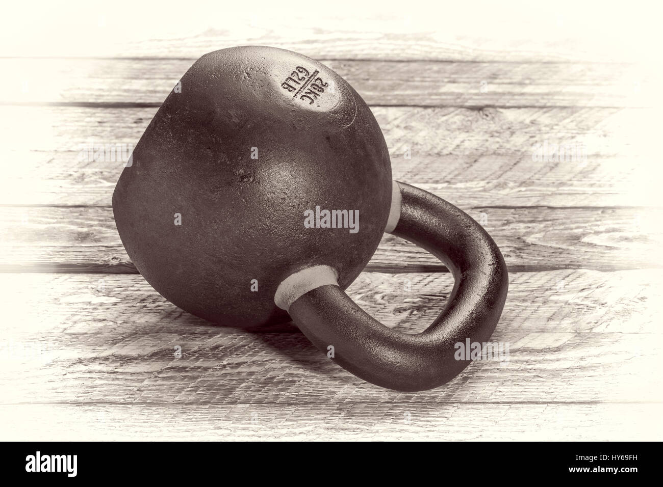 heavy iron kettlebell on a rustic wood background - fitness concept ...