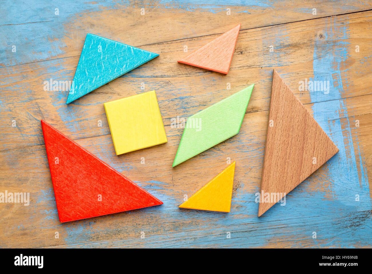 seven colorful tangram wooden pieces, a traditional Chinese puzzle game ...