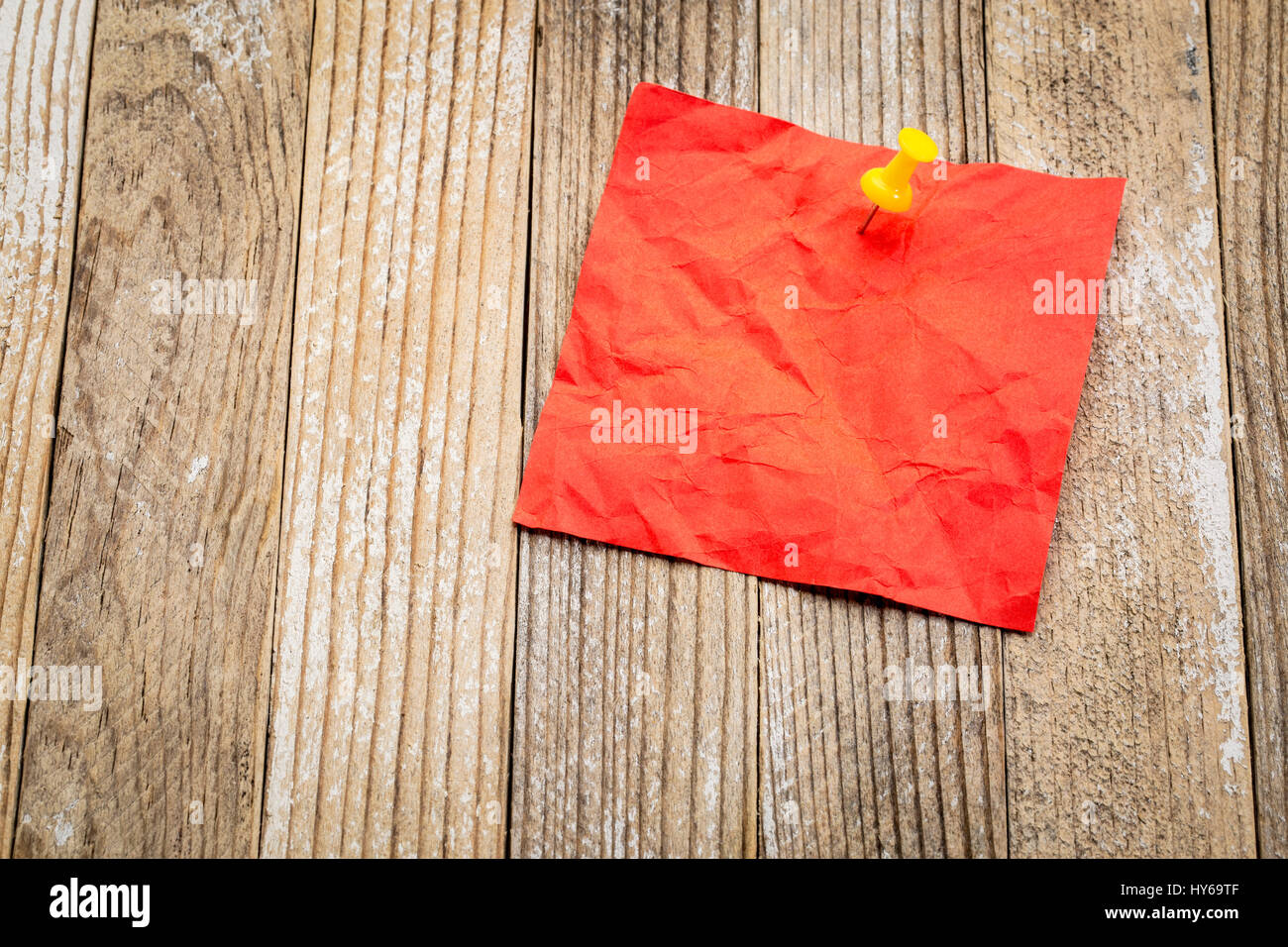 blank red crumpled sticky note against grunge painted wood - ready for ...