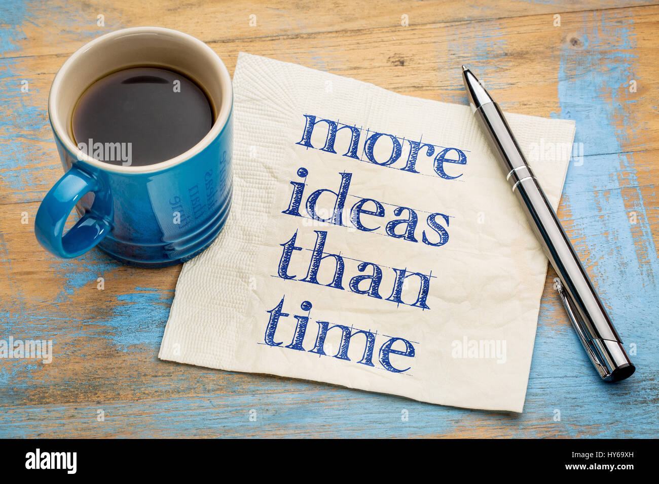 More ideas than time - creativity concept - handwriting on a napkin ...