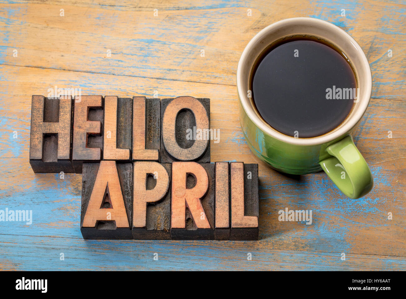Hello April word abstract in vintage letterpress wood type with a cup ...
