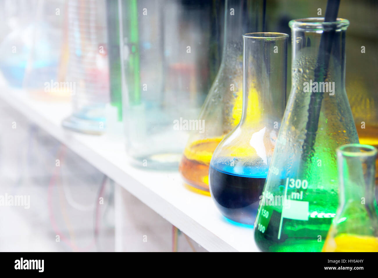 Laboratory glassware with various colored liquids Stock Photo - Alamy