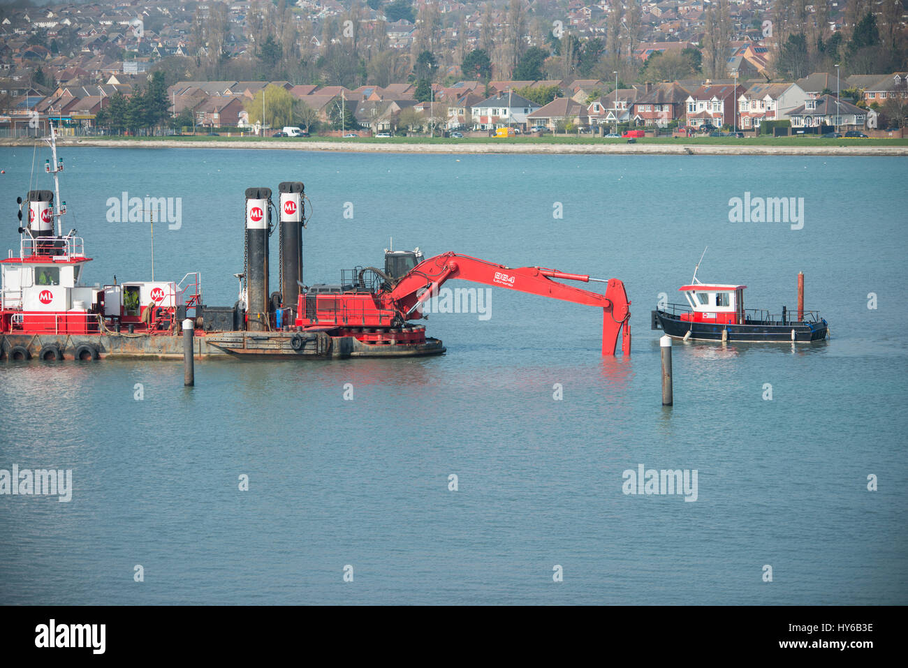 ML Dredging, digger and platform in Portsmouth Harbour Stock Photo - Alamy