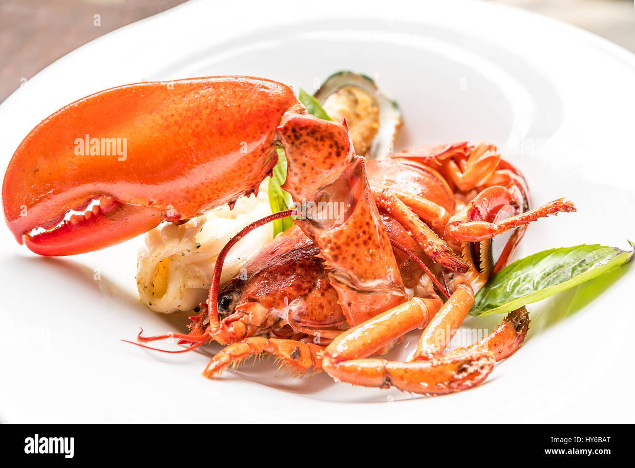 Grilled Halved Lobster Tails with mussel and calamari Stock Photo - Alamy